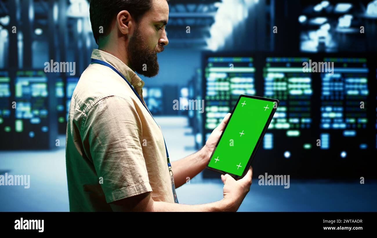 Professional Using Mock Up Tablet To Check Data Center Configuration