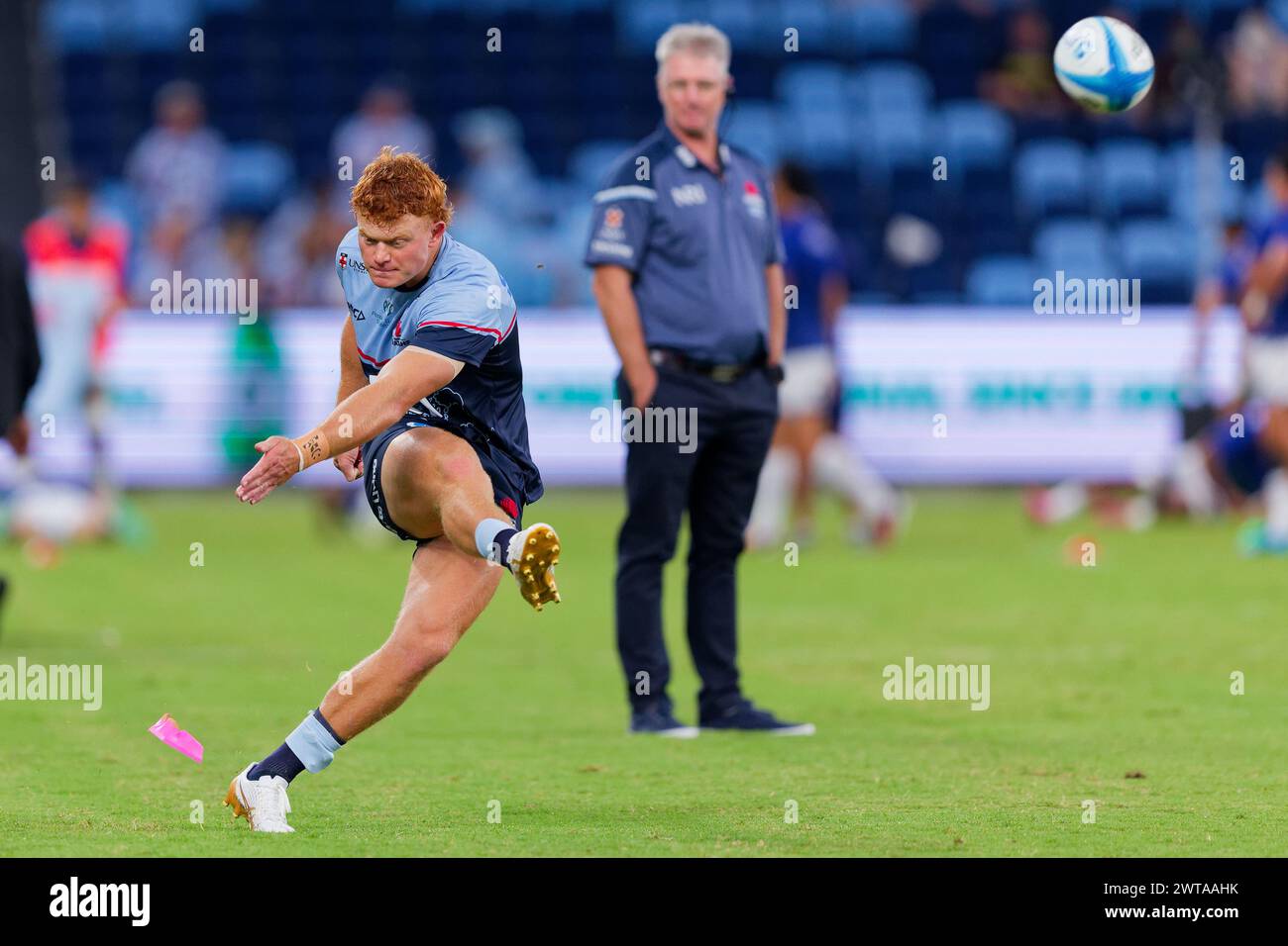 Sydney, Australia. 16th Mar, 2024. Tane Edmed of the Waratahs kicks at ...