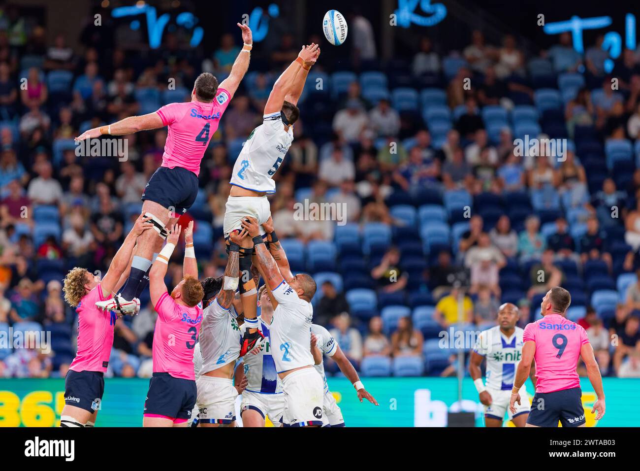 Sydney, Australia. 16th Mar, 2024. The ball passes both players during ...
