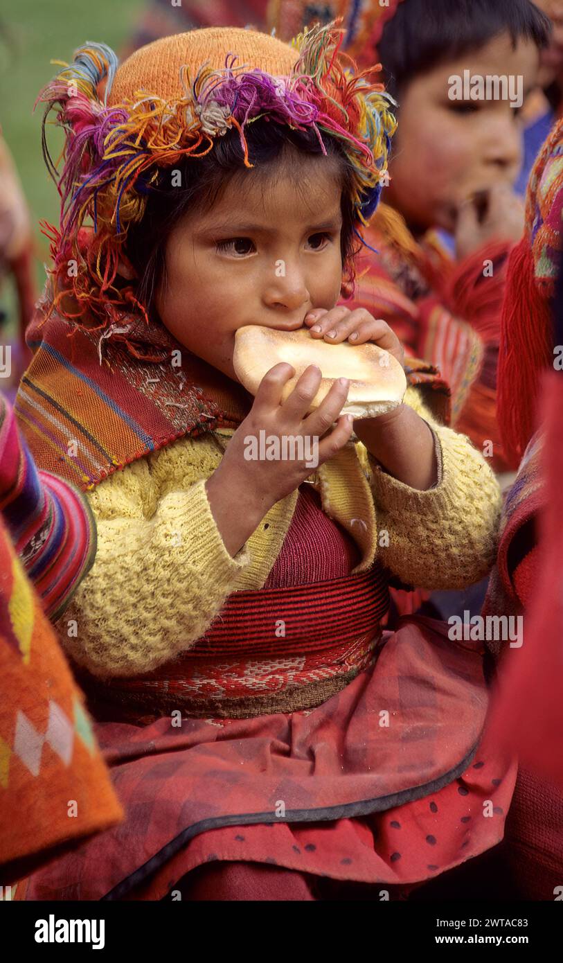 Willoq, Urubamba Valley, Peru. Quechua Girl Eating Bread Stock Photo ...
