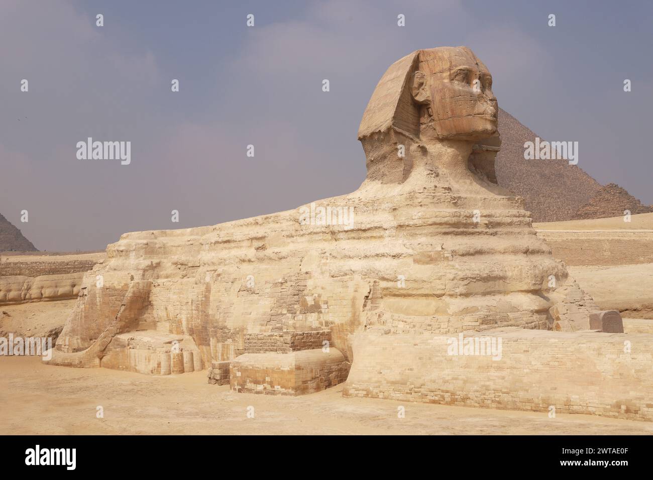 The sphinx with the great pyramid peeking out behind her shoulder. Giza ...