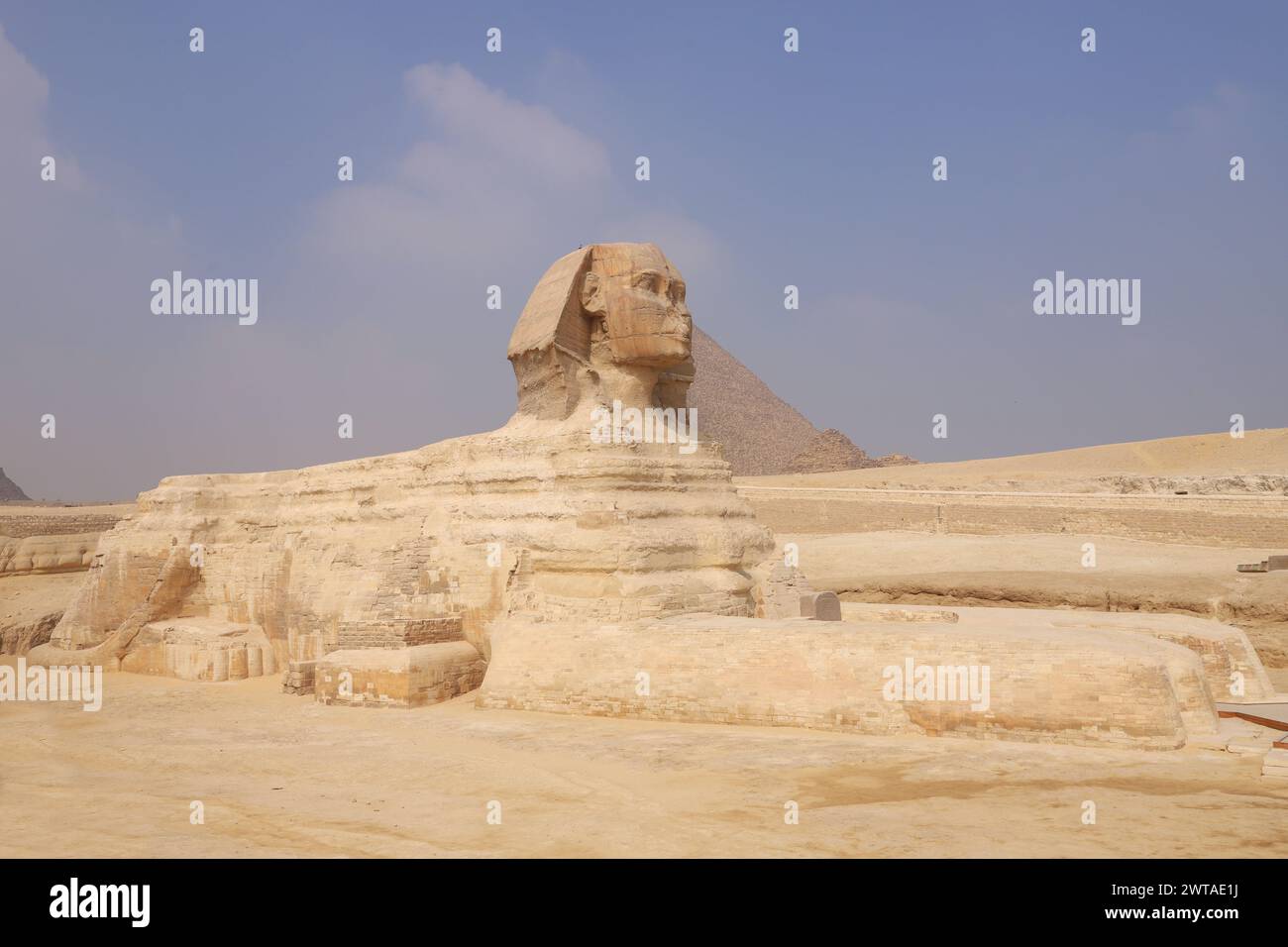 The sphinx with the great pyramid peeking out behind her shoulder. Giza ...