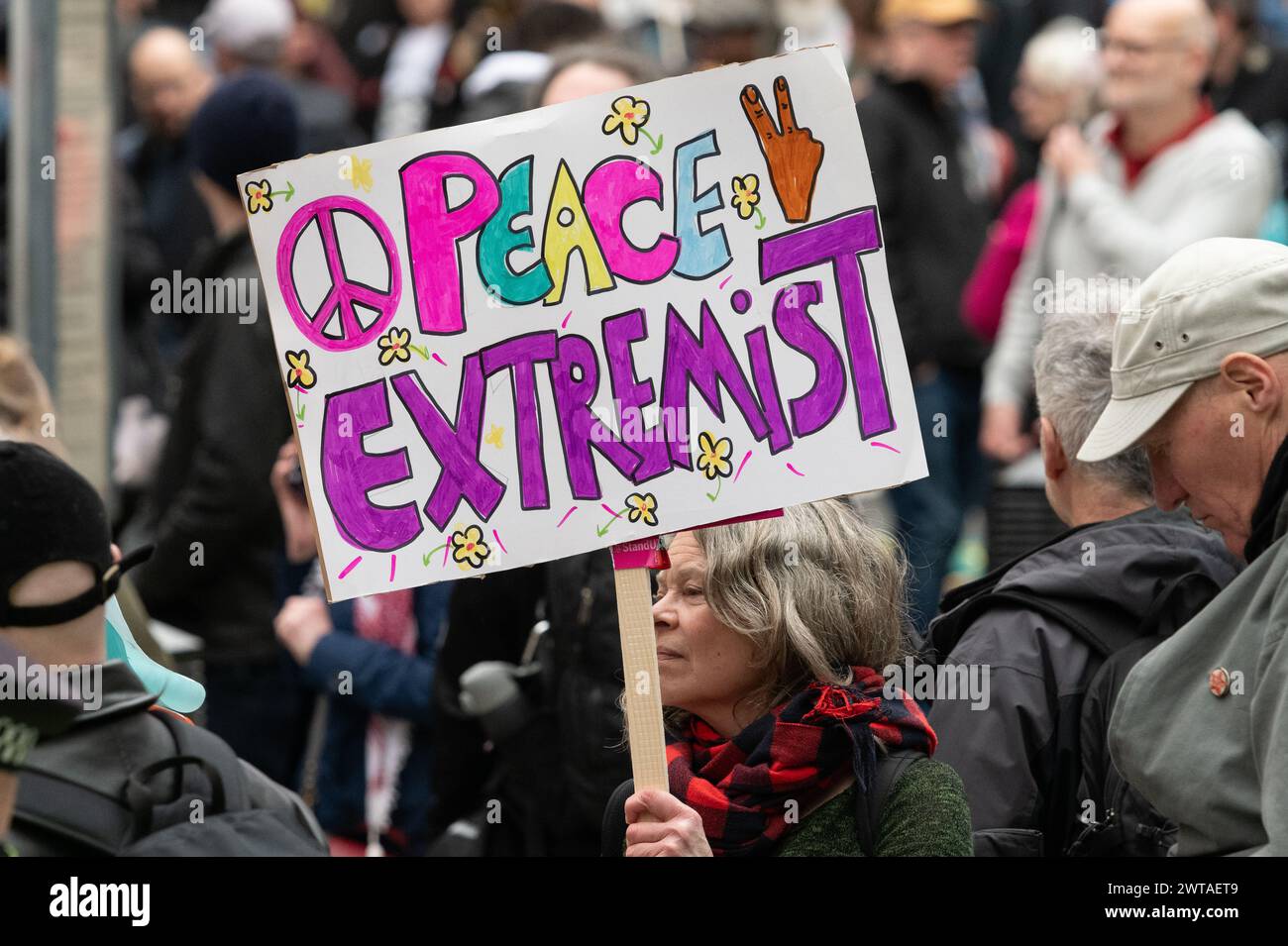 London, UK. 16 March, 2024. A woman hold a placard saying "Peace ...