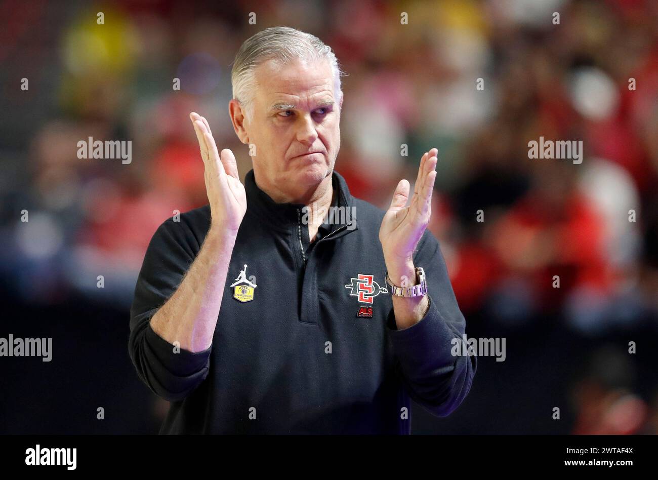 San Diego State head coach Brian Dutcher applauds after a play during ...
