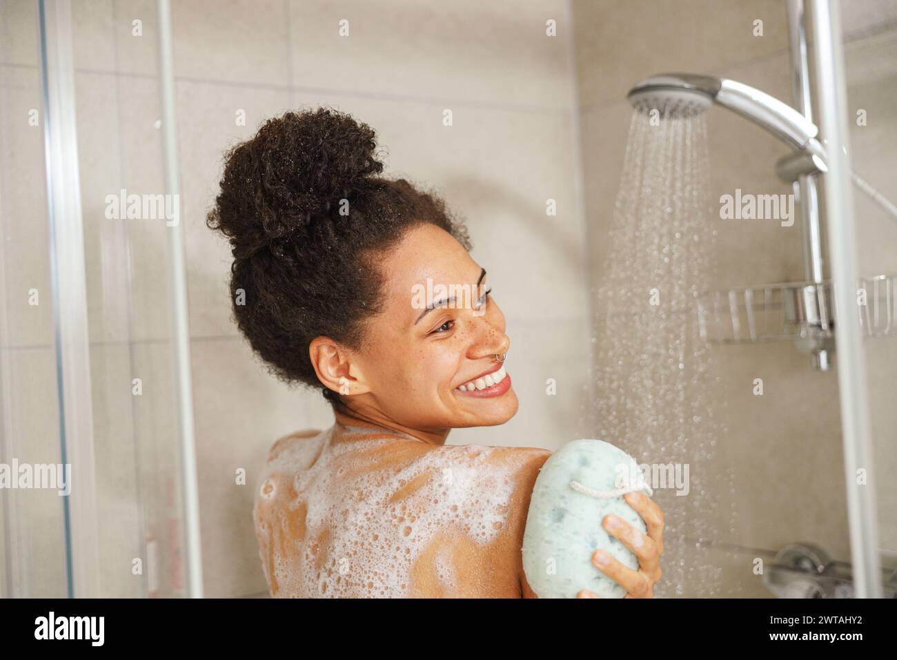 Woman shower sponge wash happy hi-res stock photography and images - Alamy