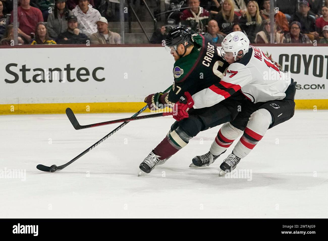 New Jersey Devils defenseman Simon Nemec reaches in for the puck ...