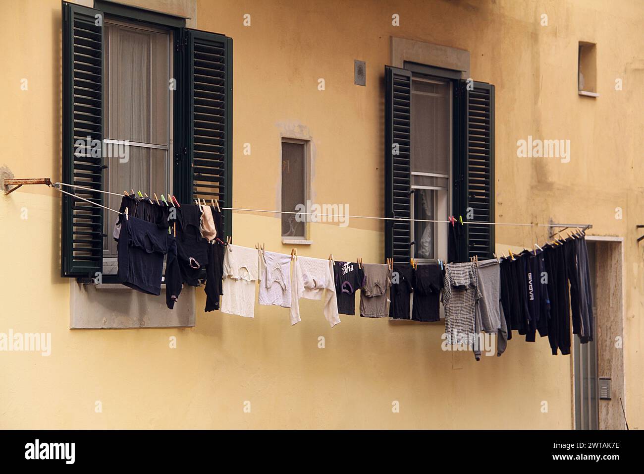 Matera, Italy. Clothing drying outside the windows of a private ...