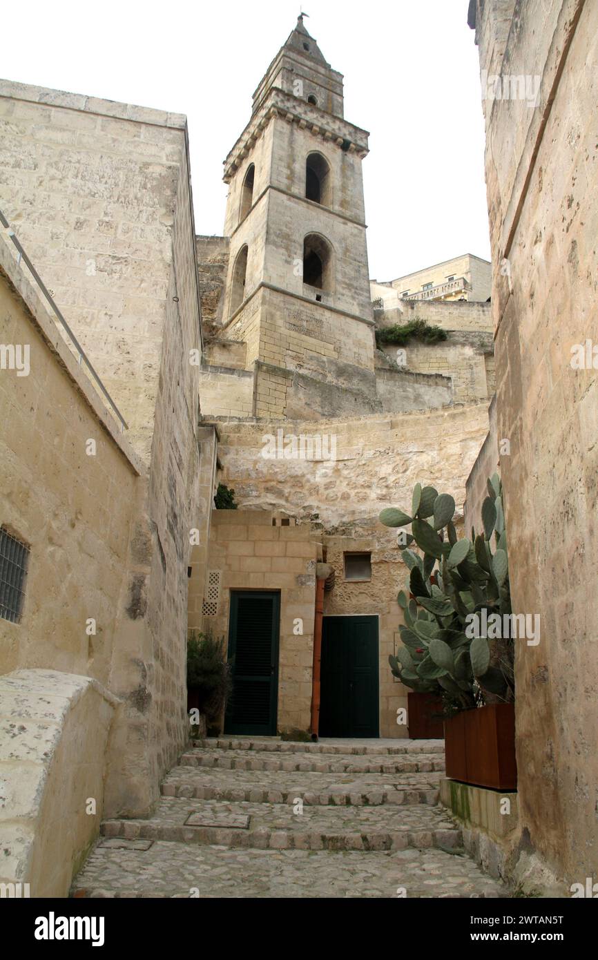 Matera, Italy. Alleyway in the Sasso Barisano area, with the tower of ...
