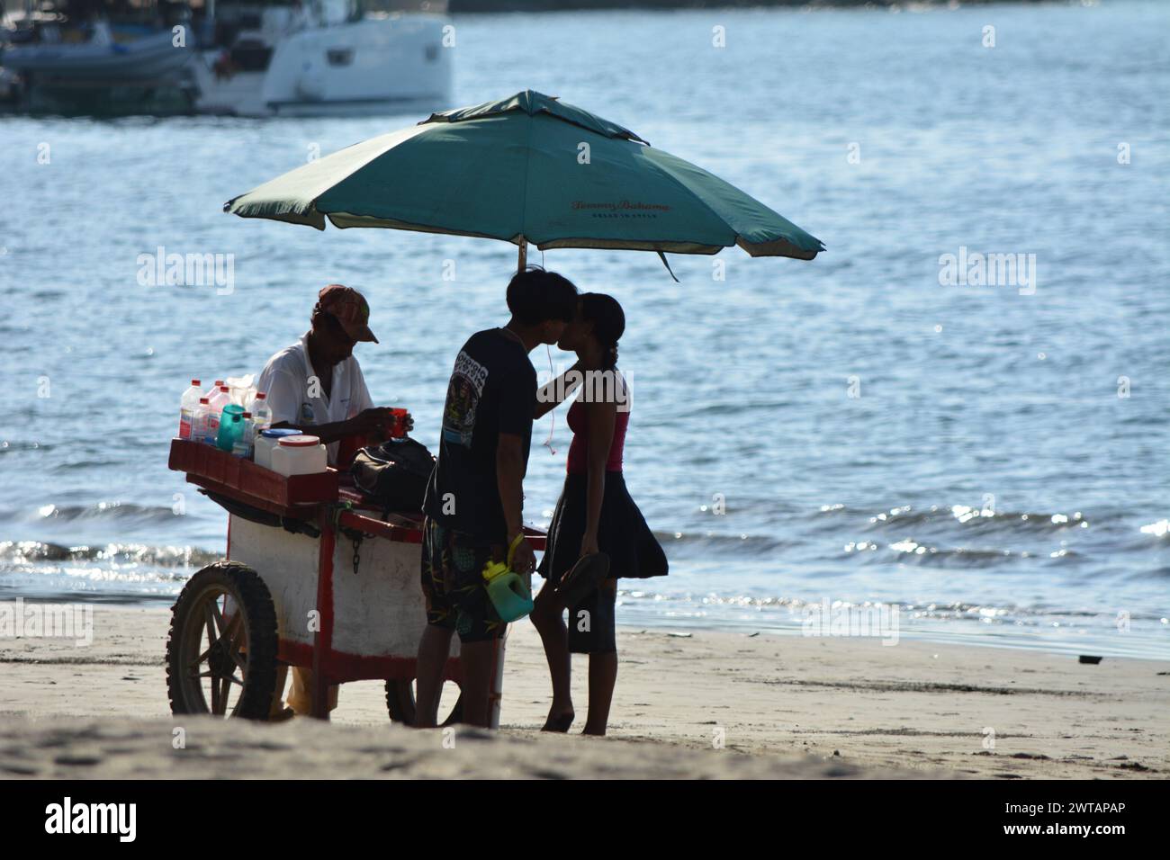 Various people involved in activities on Costa Rican beach Stock Photo ...