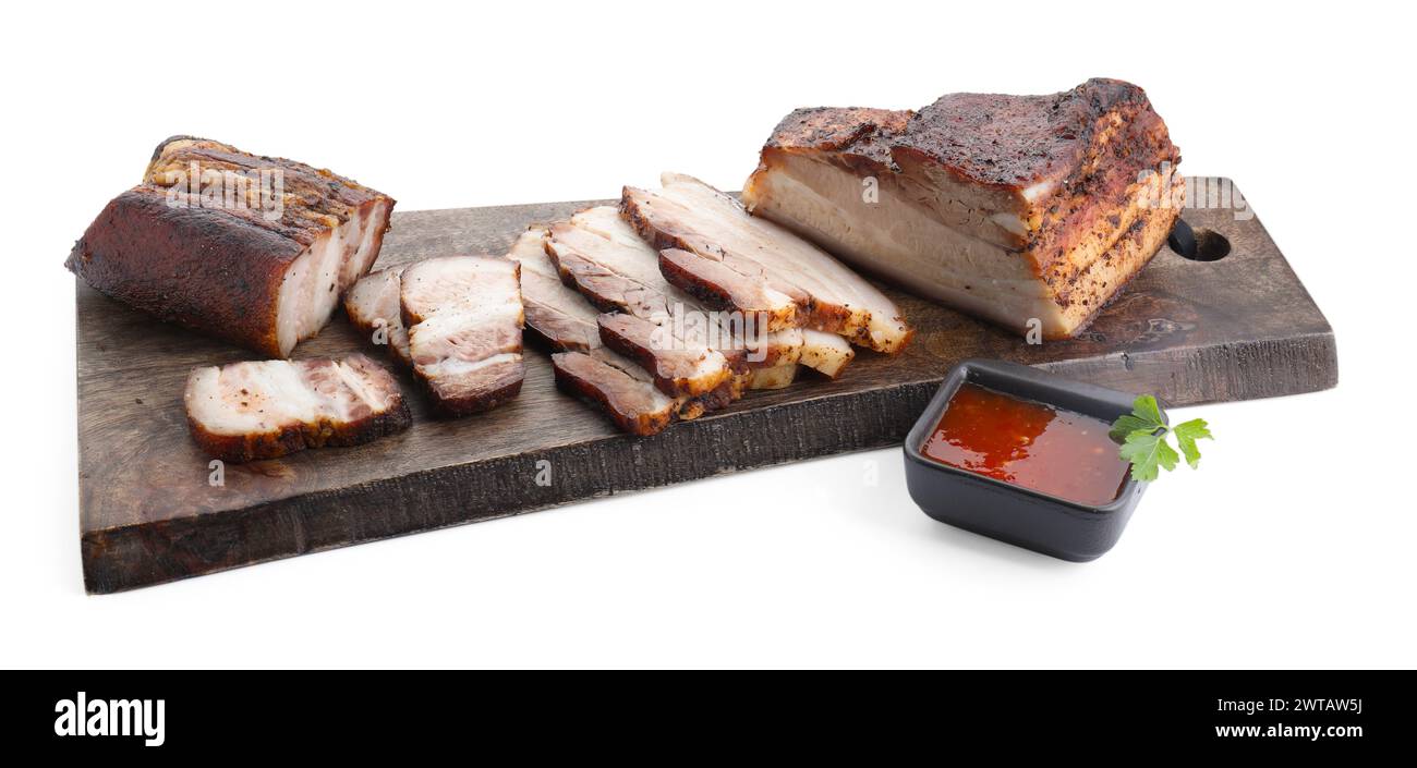 Pieces of tasty baked pork belly and sauce isolated on white Stock ...