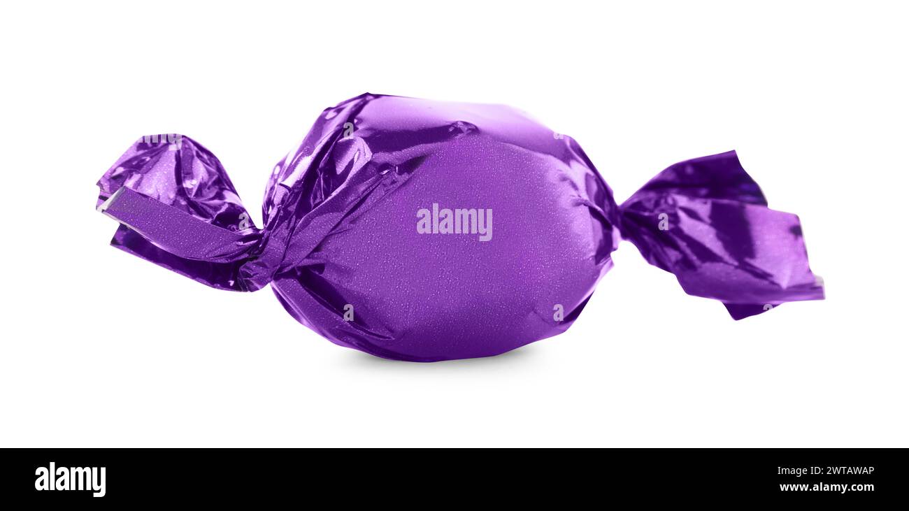 Candy in purple wrapper isolated on white Stock Photo - Alamy