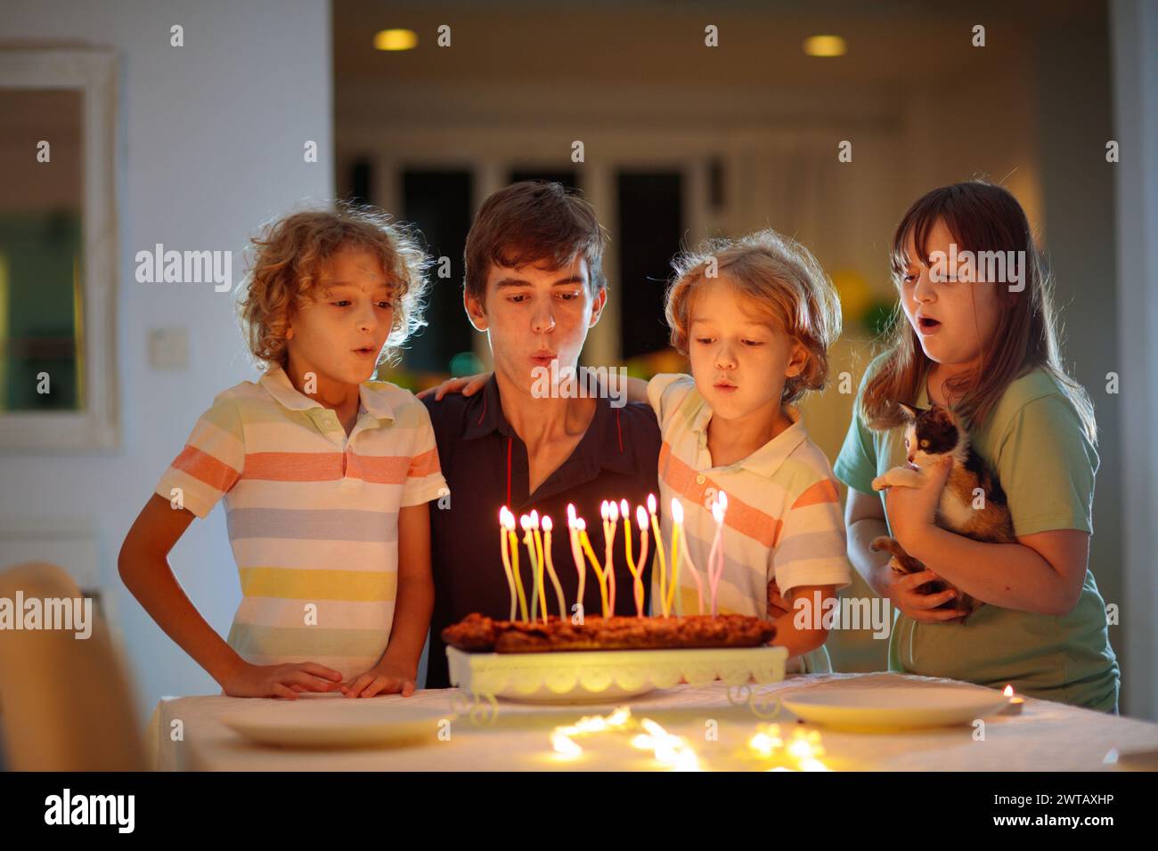 Teenager boy birthday with family and younger brother and sister ...