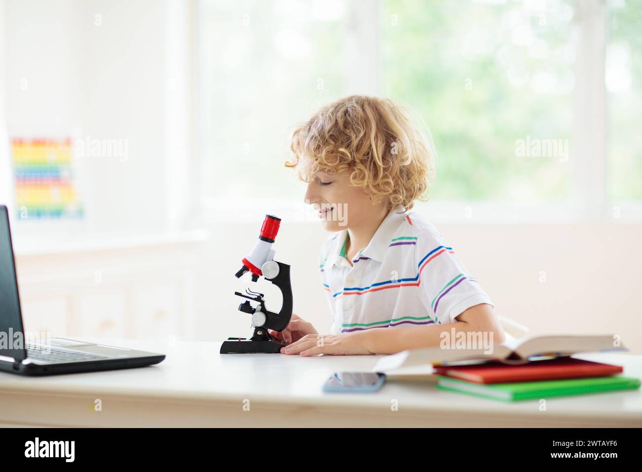 School kids with microscope. Science class. Children making biology or ...