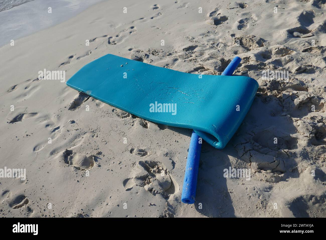 Tropical beach vacation with footprints in sand and beach recreational ...