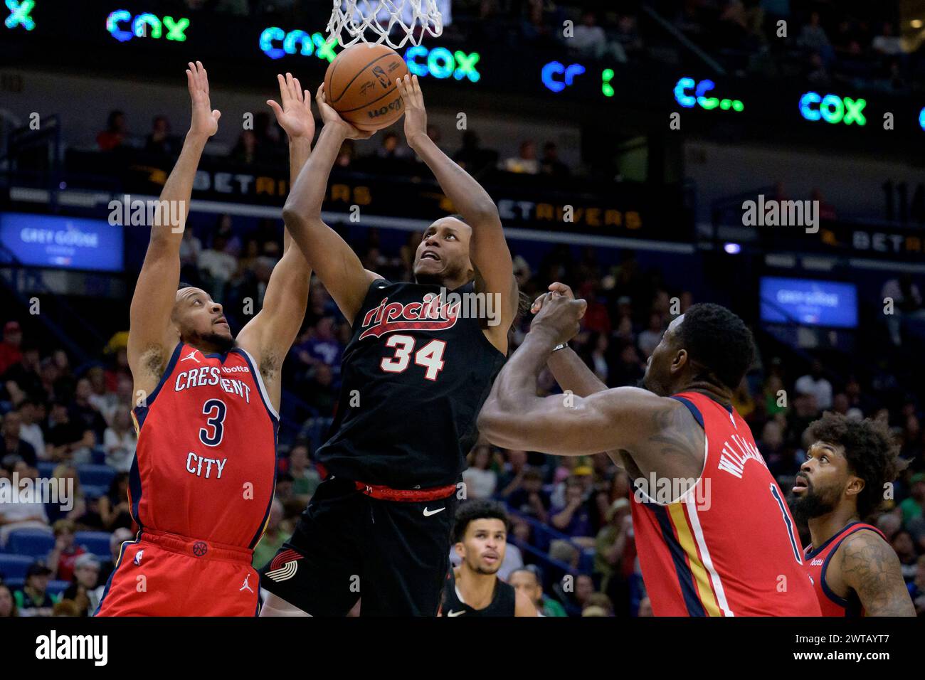 New Orleans Pelicans guard CJ McCollum (3) and forward Zion Williamson (1) defend as Portland ...
