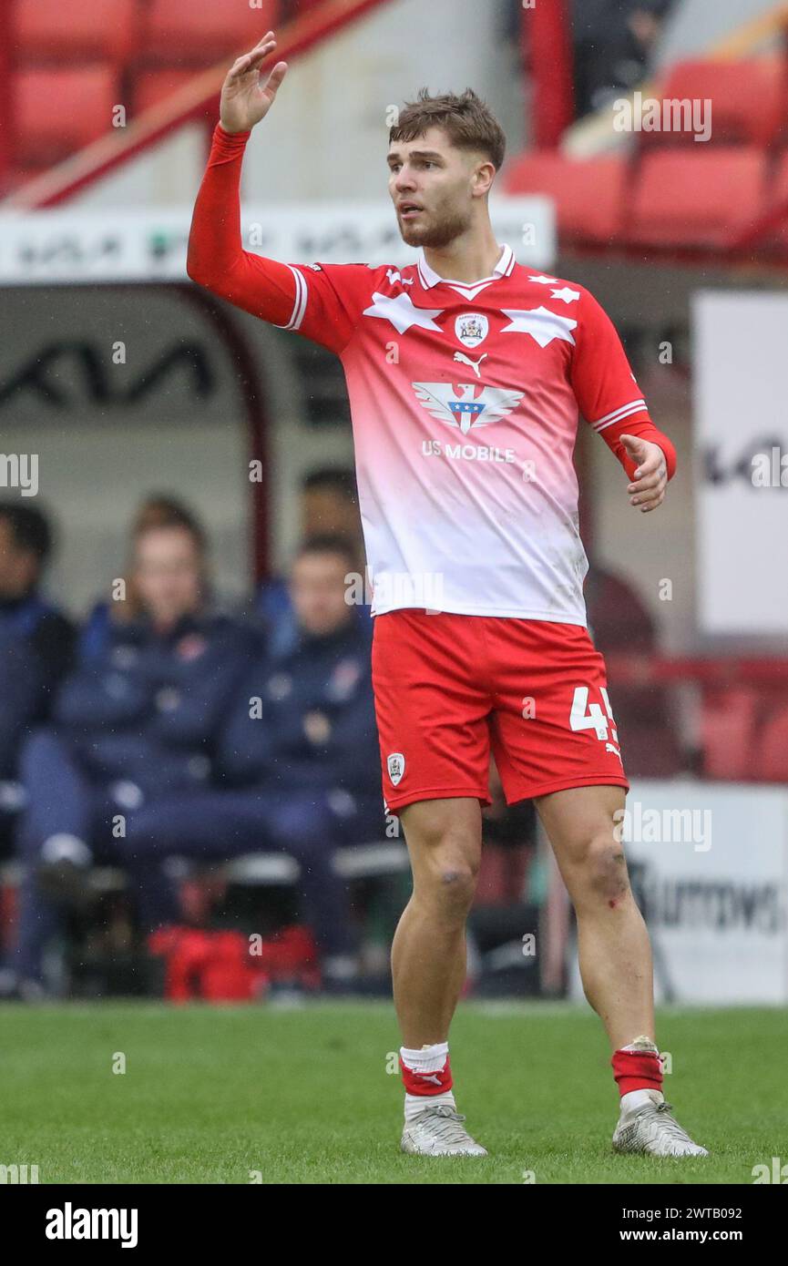 Barnsley, UK. 17th Mar, 2024. John Mcatee of Barnsley gives his team ...