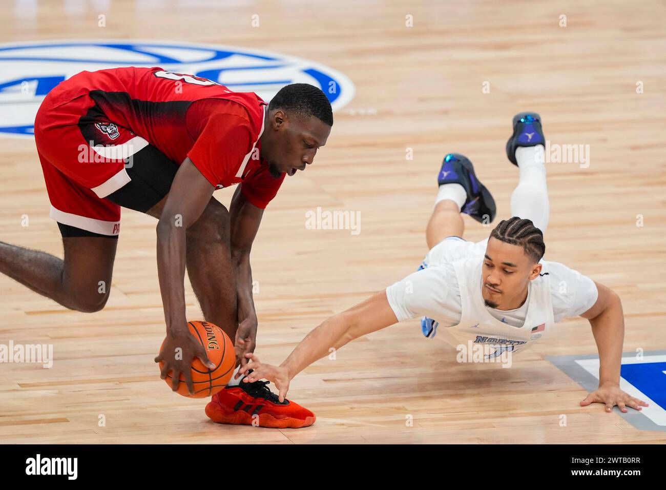 North Carolina State forward Mohamed Diarra (23) and North Carolina ...