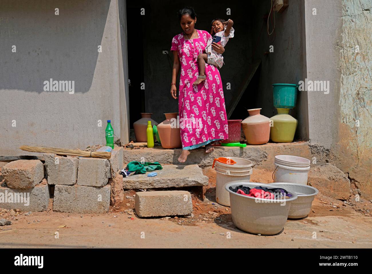 A resident of Ambedkar Nagar, a low-income settlement in the shadows of ...