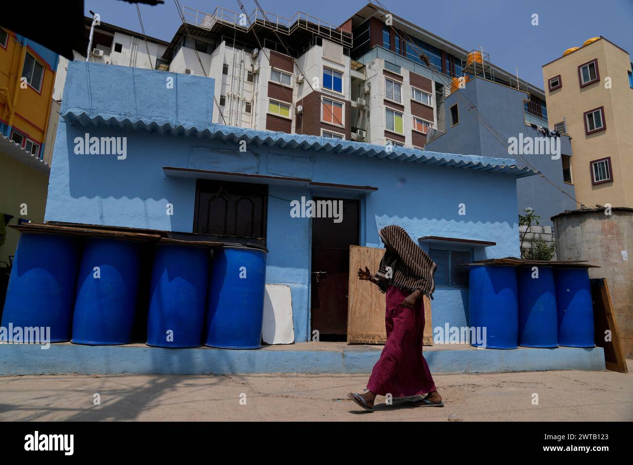 A resident of Ambedkar Nagar, a low-income settlement in the shadows ...