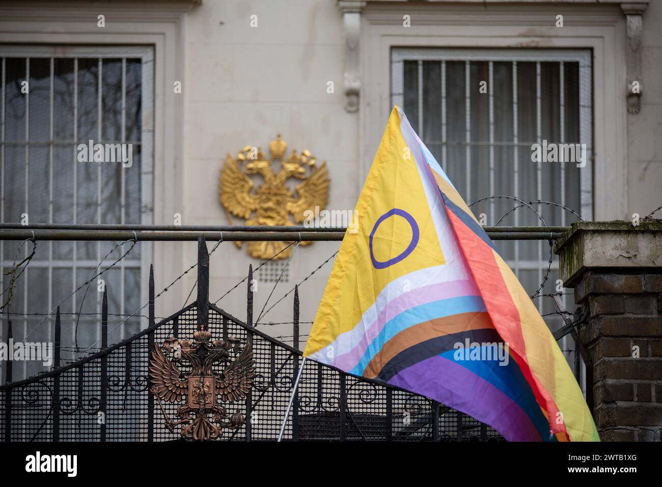 London, UK. 16th Mar, 2024. A progress Pride flag flies by the coat of ...