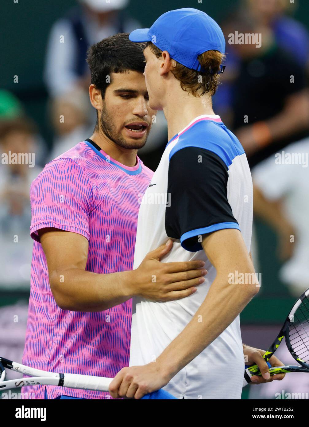 March 16, 2024 Carlos Alcaraz of Spain shakes hands with Jannik Sinner of Italy after winning ...