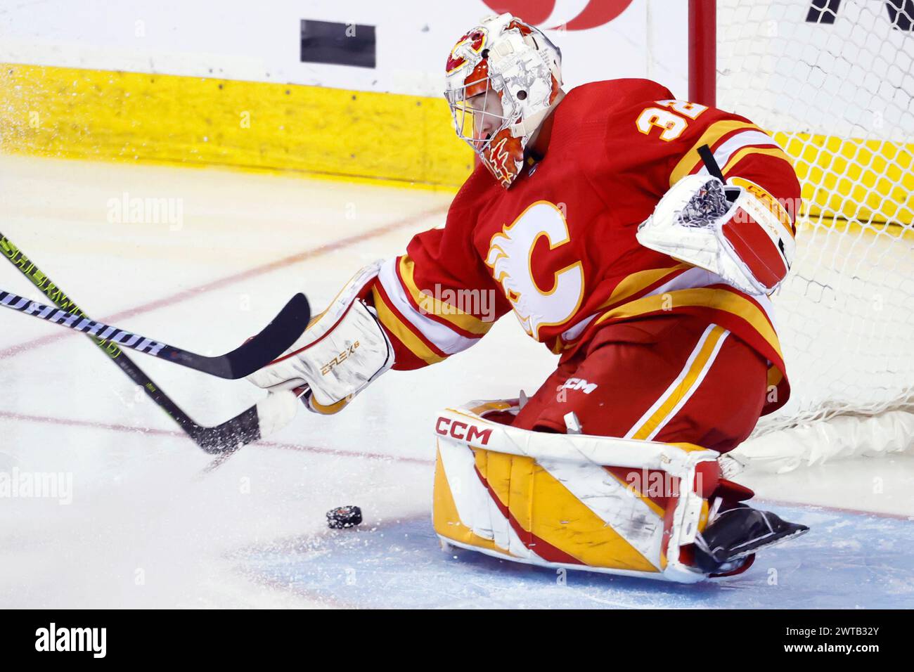 Calgary Flames goalie Dustin Wolf makes a save during third-period NHL ...