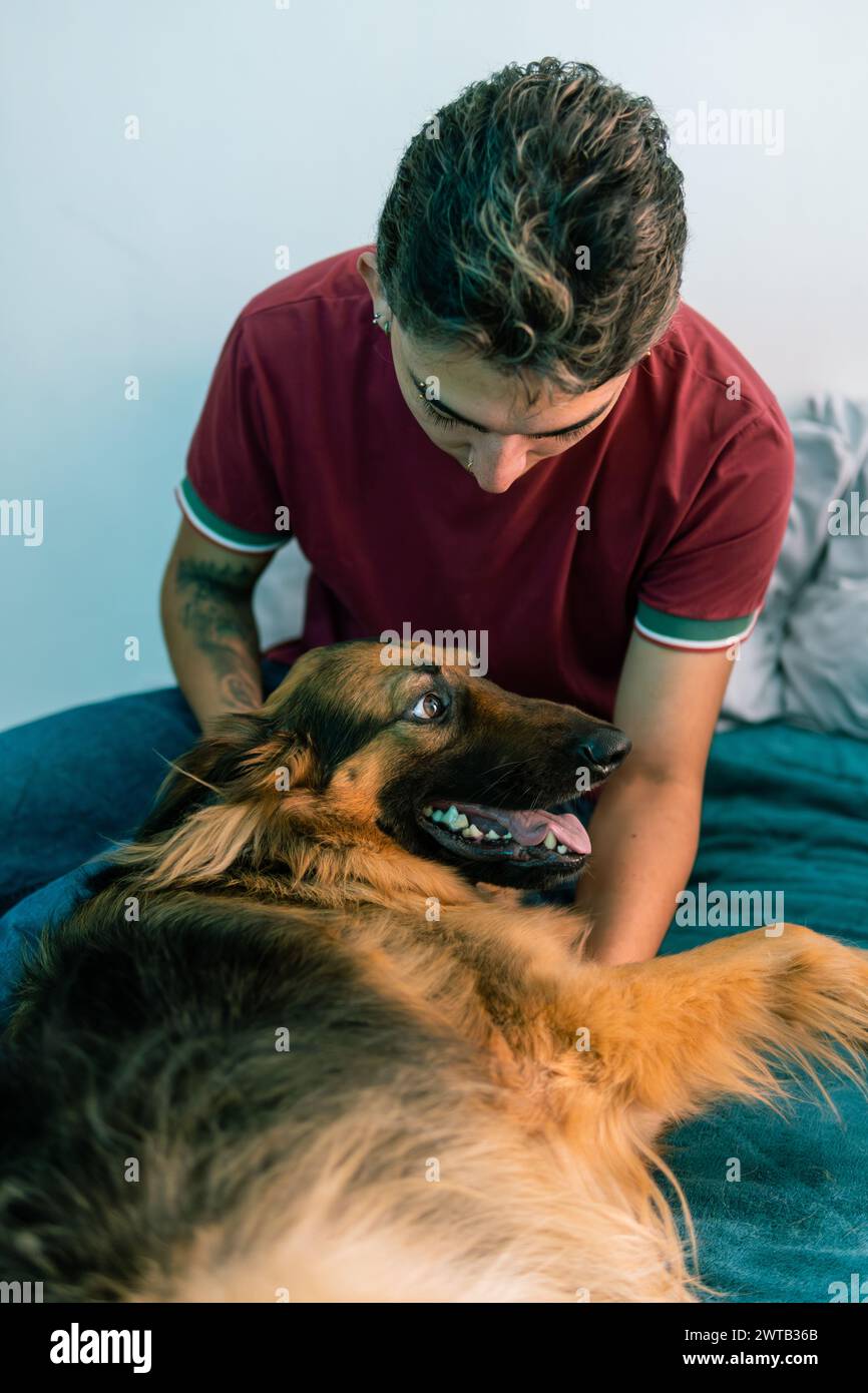 An intimate moment of connection as a young Latino man lovingly gazes ...