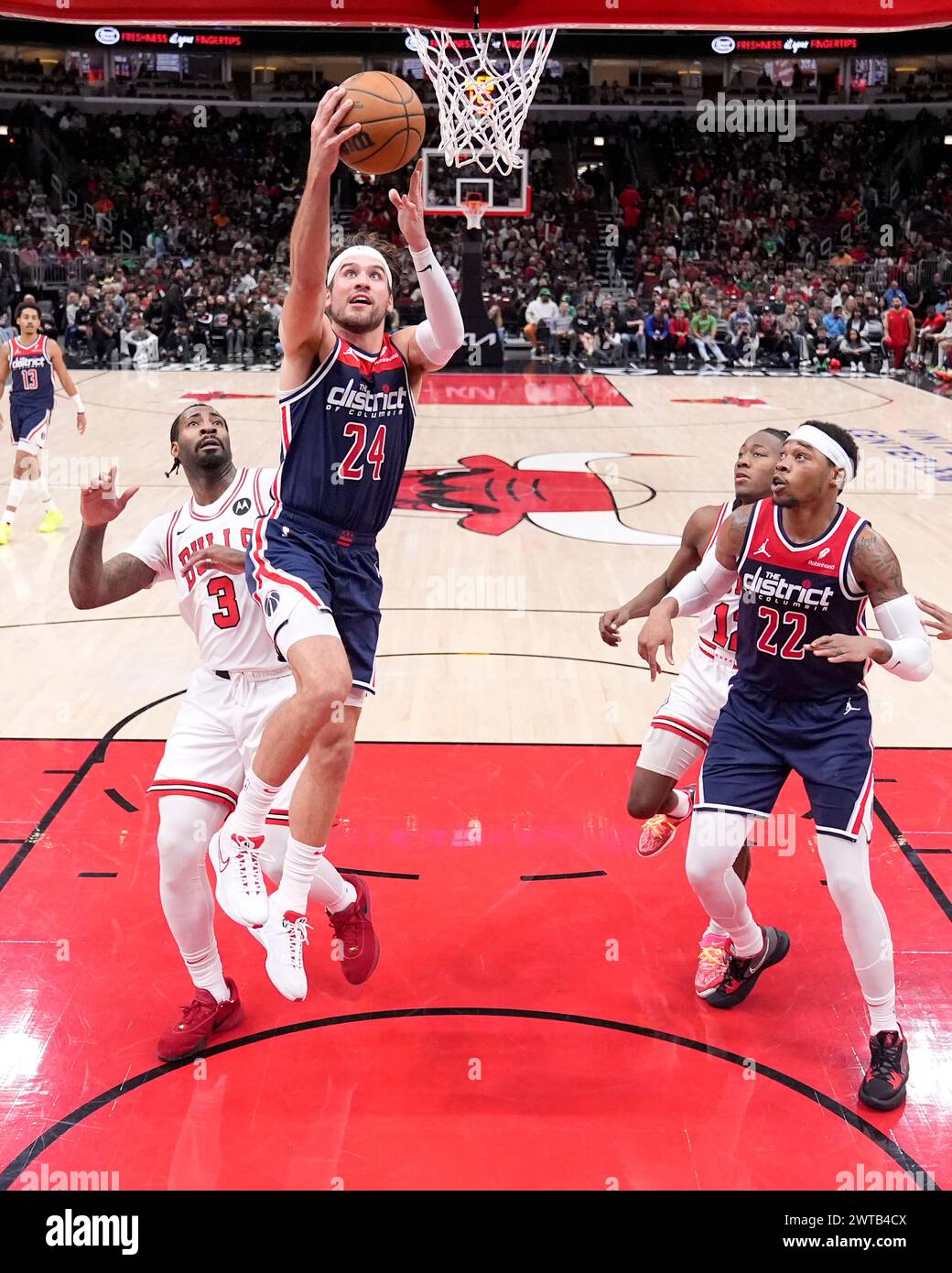 Washington Wizards' Corey Kispert (24) drives to the basket past ...