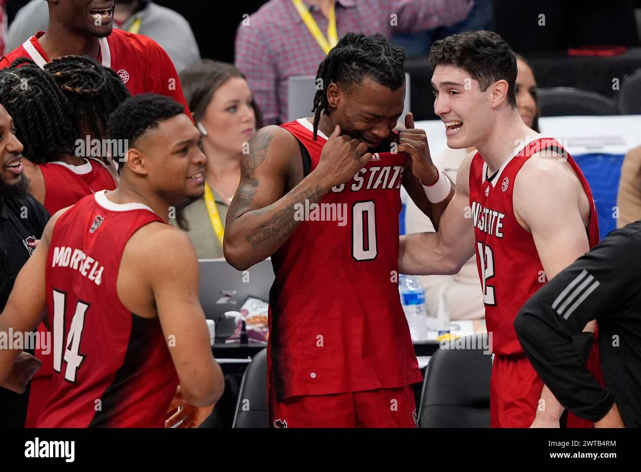 North Carolina State guard DJ Horne (0) is consoled by teammate North ...