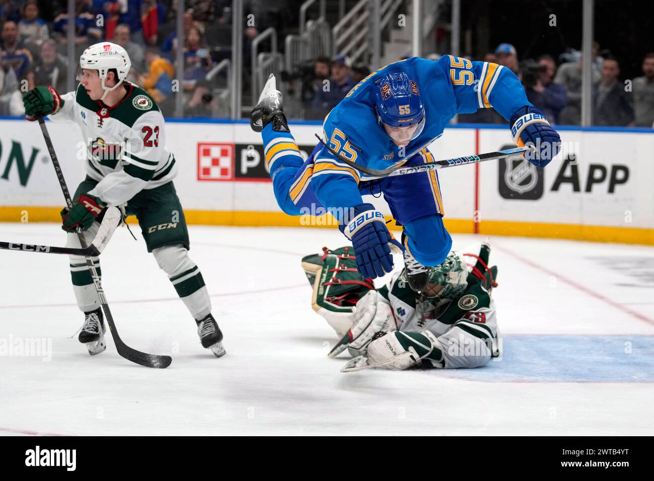 St. Louis Blues' Colton Parayko (55) flies over Minnesota Wild ...