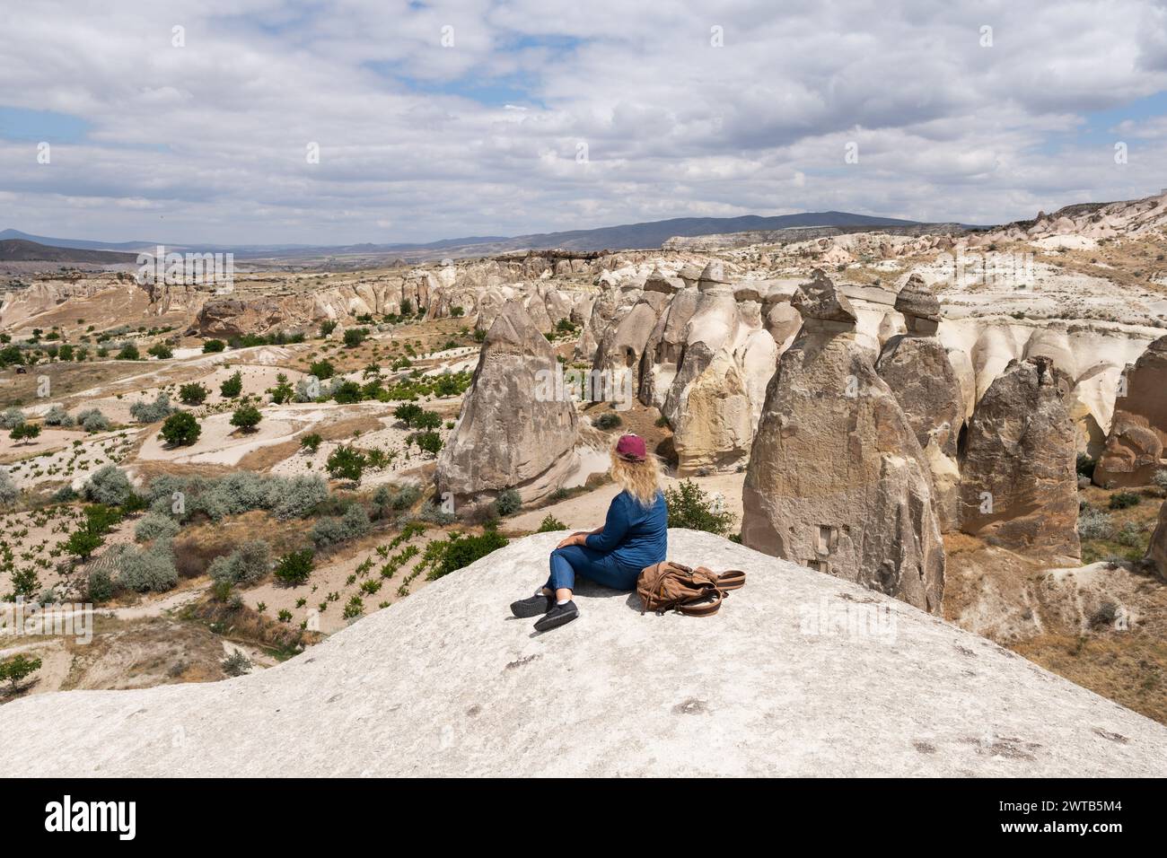 Woman travelling in Cappadocia, exploring fairy chimney valley in ...