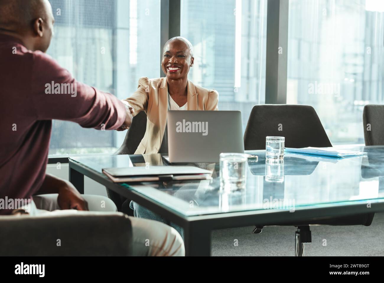 Business people in an office setting engage in a successful interview ...