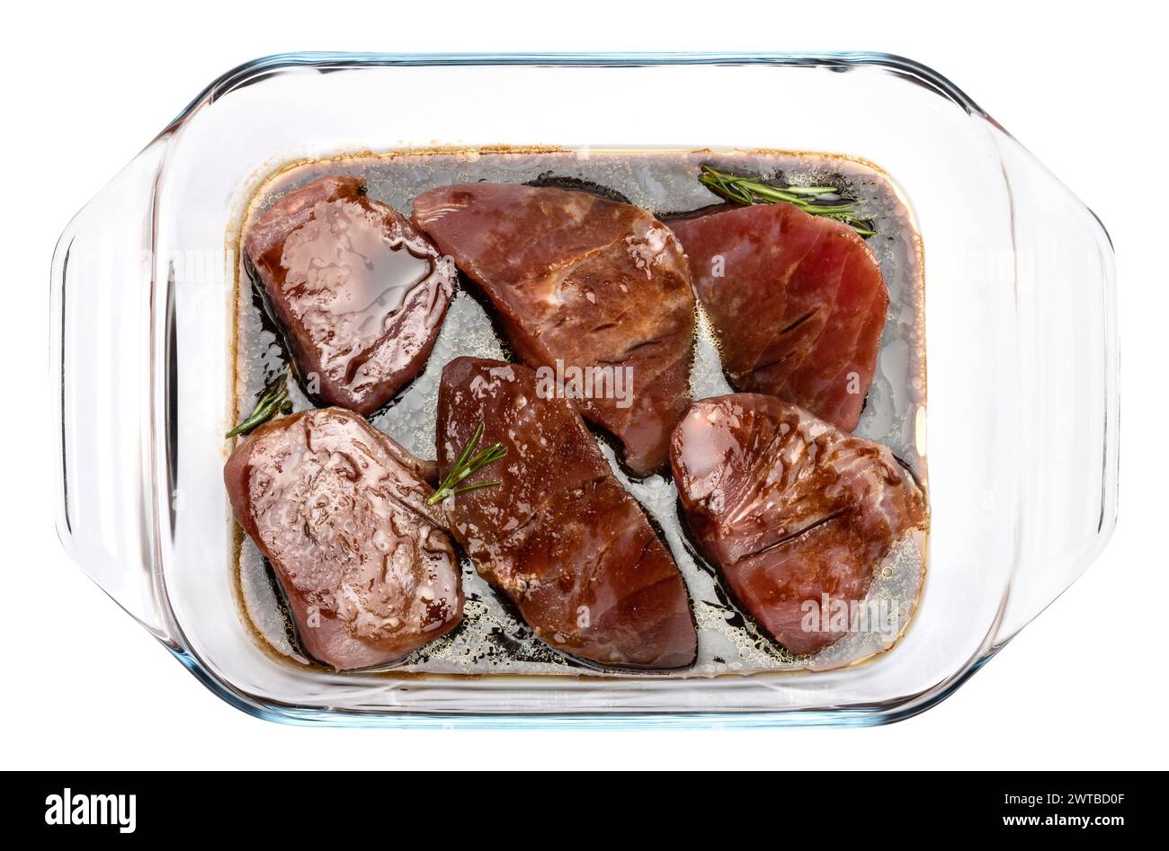 marinated Pieces of tuna Fish fillet in glass cooking dish isolated on ...