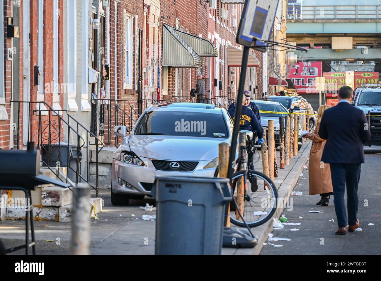 Authorities scour the area for clues at the crime scene on East ...