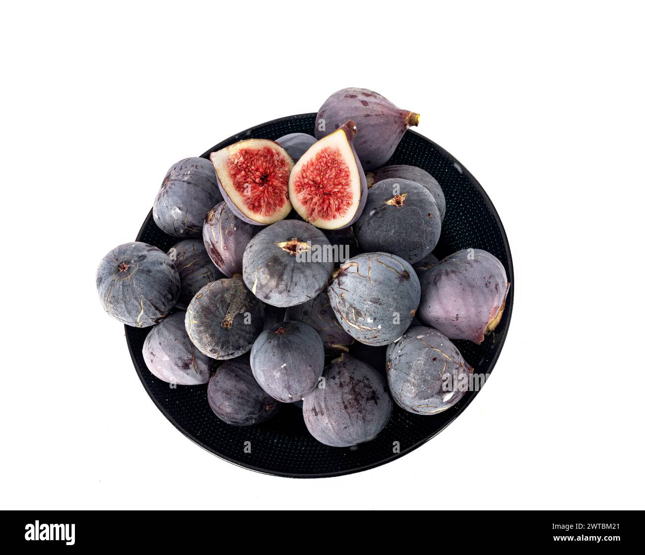 purple figs in front of white background Stock Photo - Alamy