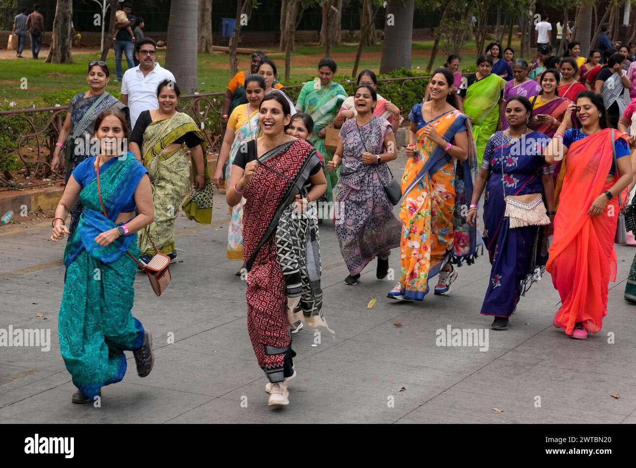 Women in traditional sarees participate in a 'Saree Run' in Hyderabad ...