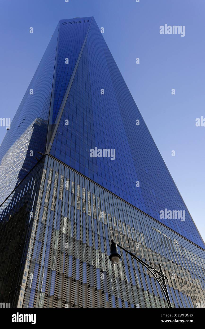 Shadow play and reflections on a glass skyscraper, downtown Manhattan ...
