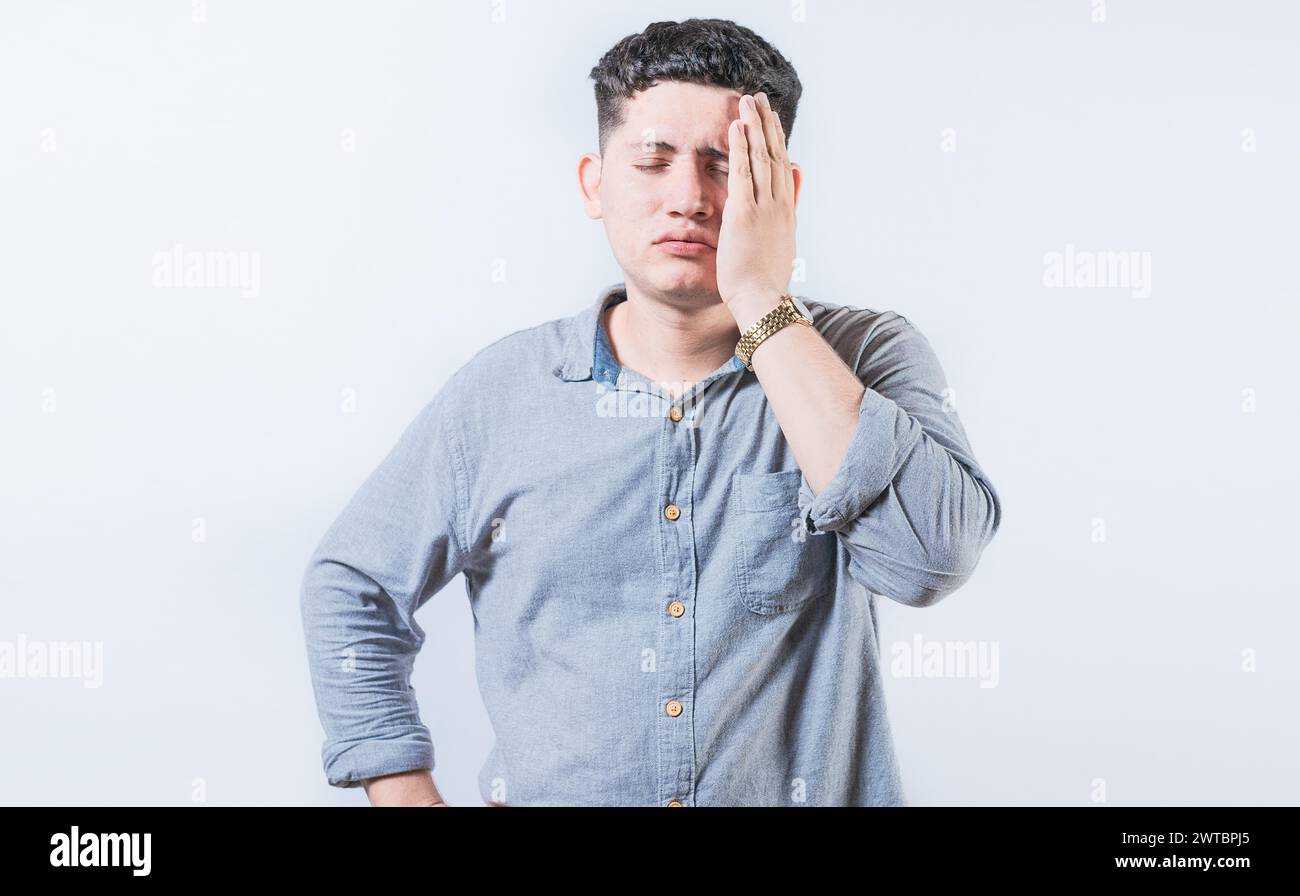 Exhausted person putting the palm of his hand on his face. Tired and ...