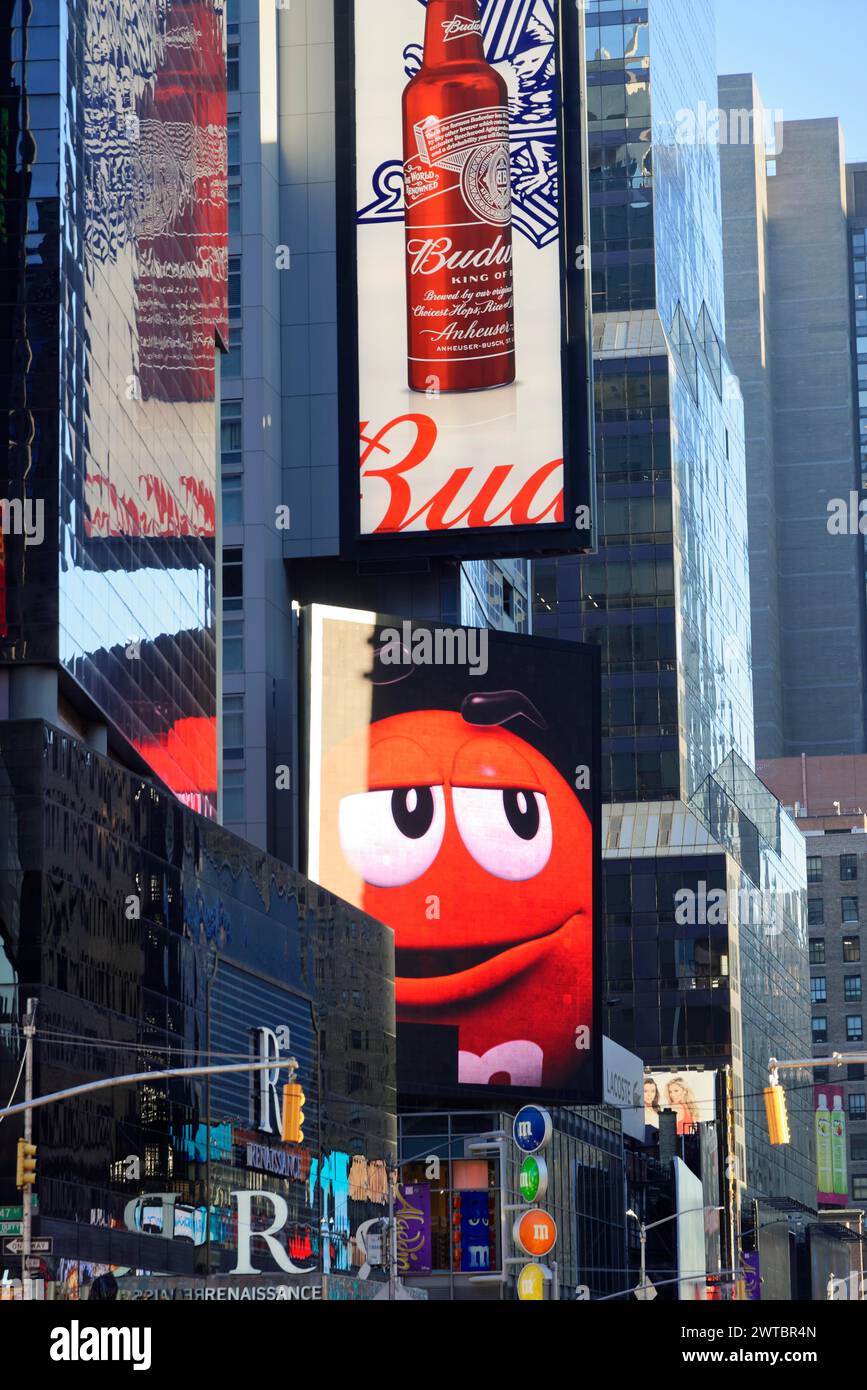 High-rise facade with billboards and a large screen with a cartoon ...