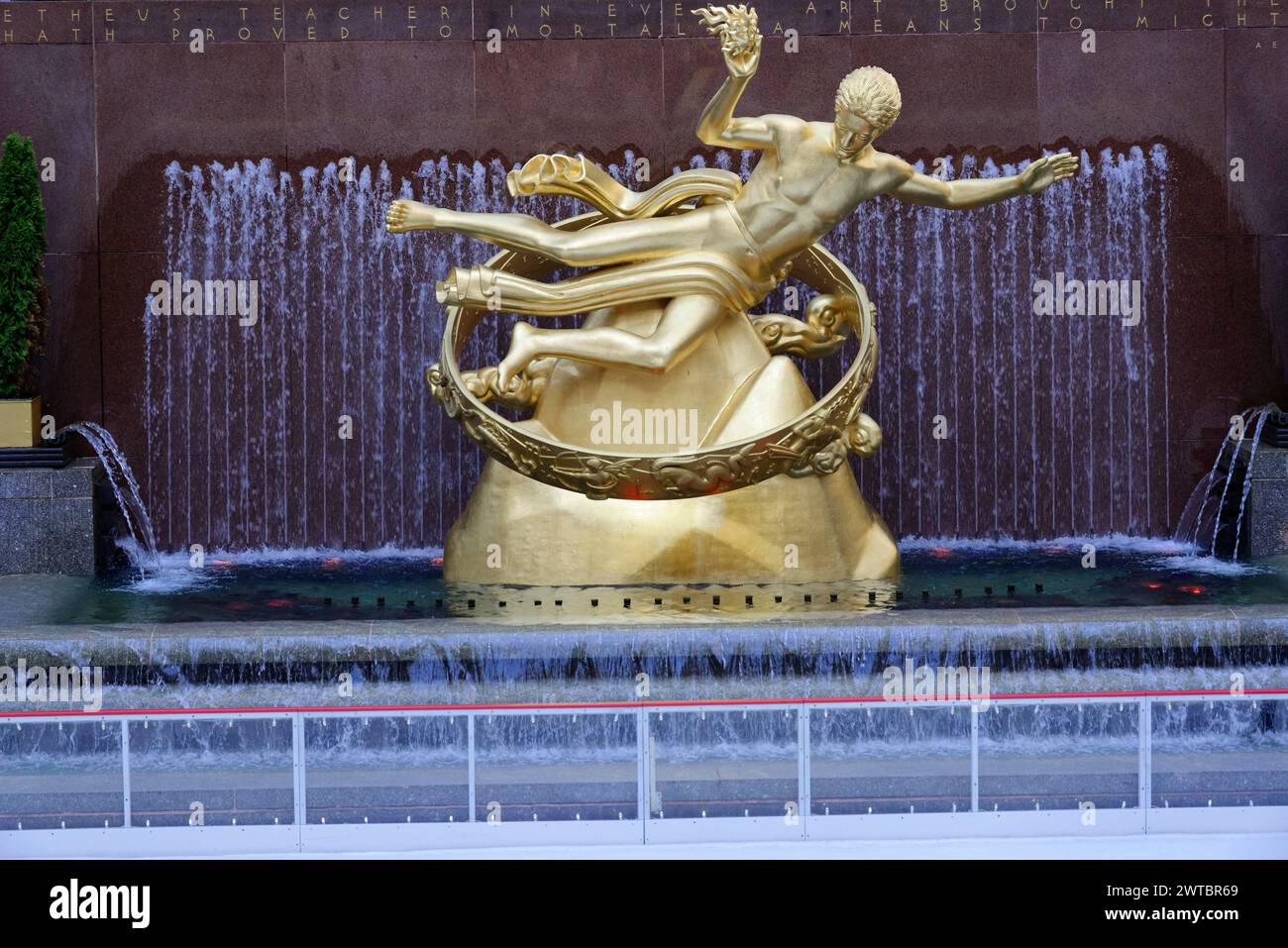 Gilded Prometheus sculpture in front of a water feature at Rockefeller ...