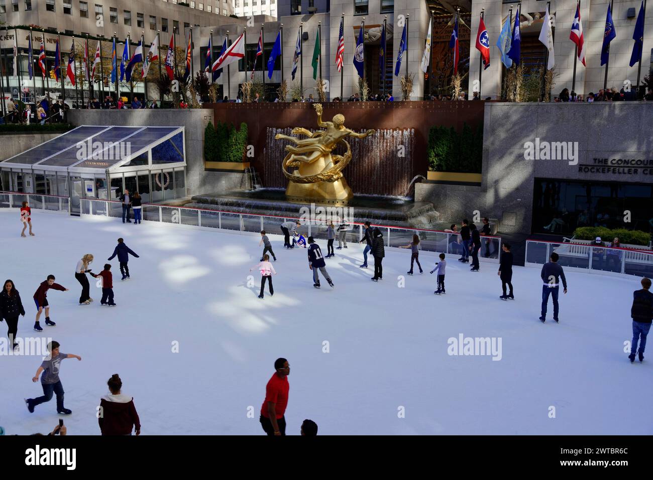Rockefeller Center observation deck, ice skaters enjoying their time on ...