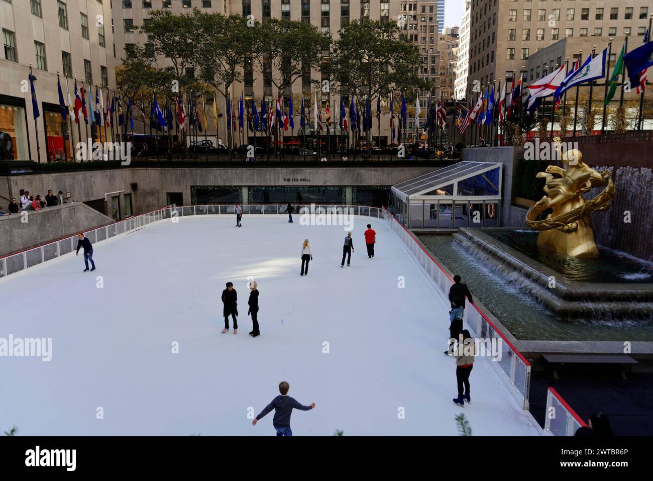 Visitors enjoy ice skating at Rockefeller Center by the Prometheus ...