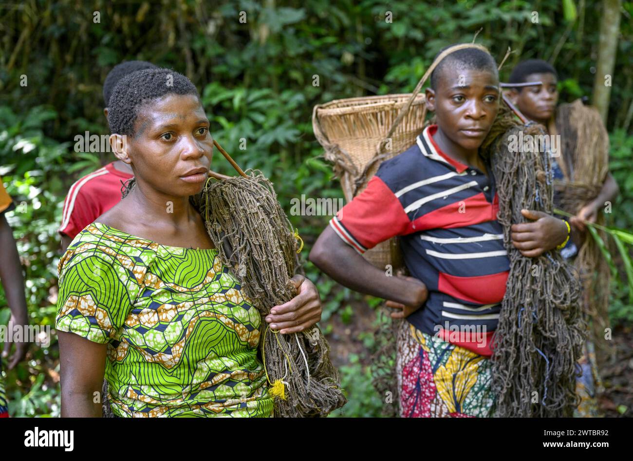 Pygmy woman of the Baka or BaAka people with their hunting nets, Dzanga ...