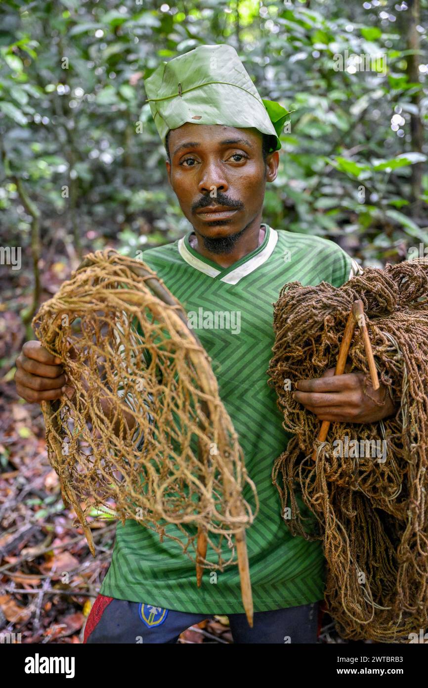 Pygmy of the Baka or BaAka people with his traps and hunting nets in ...