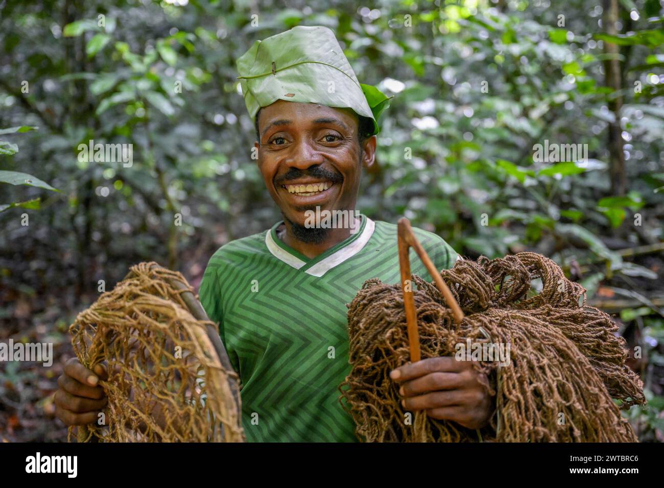 Pygmy of the Baka or BaAka people with his traps and hunting nets in ...