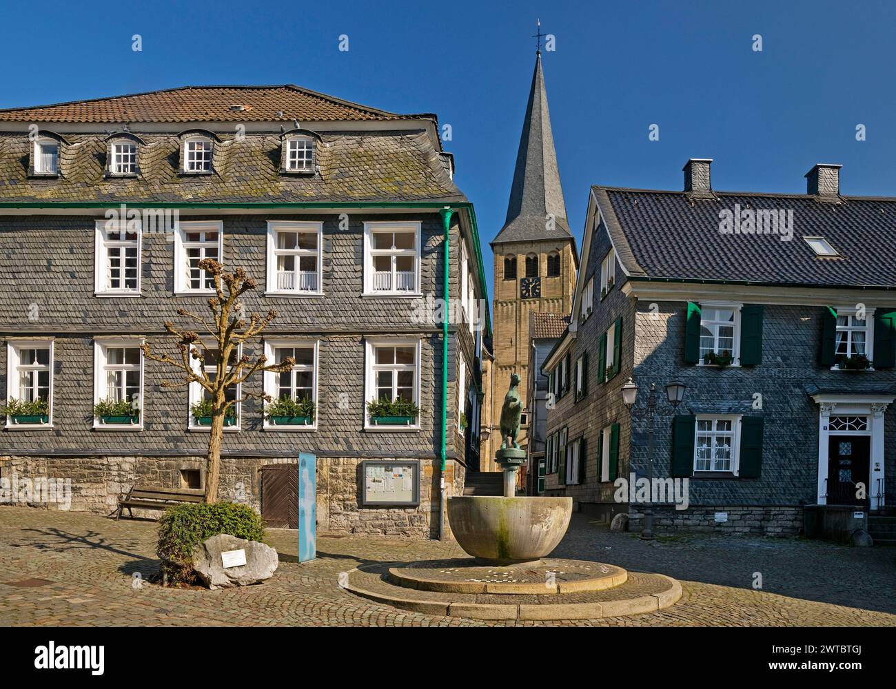 Historic upper town with horse fountain and church tower of St ...