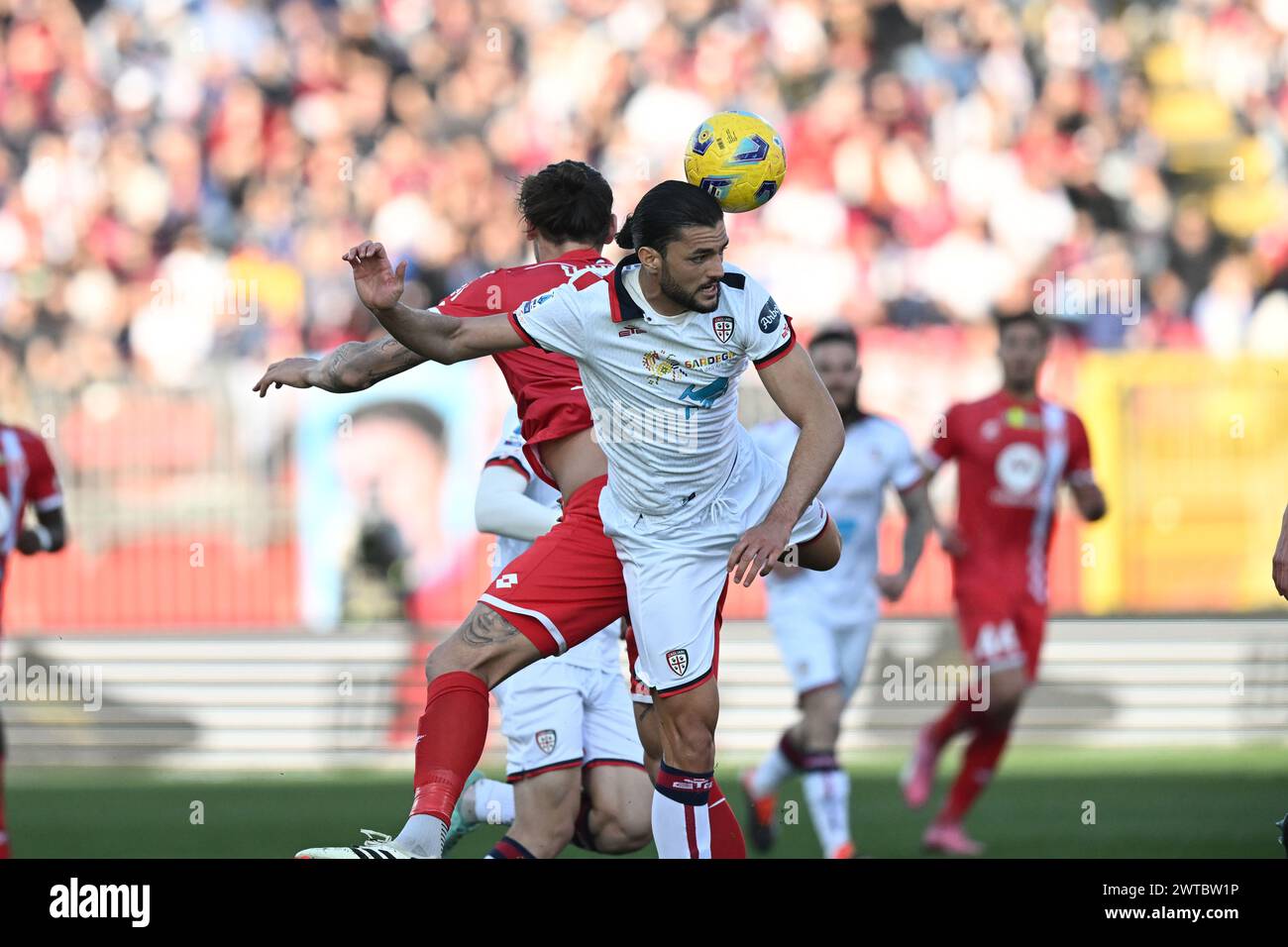 Alberto Dossena (Cagliari)Milan Djuric (Monza) during the Italian Serie ...