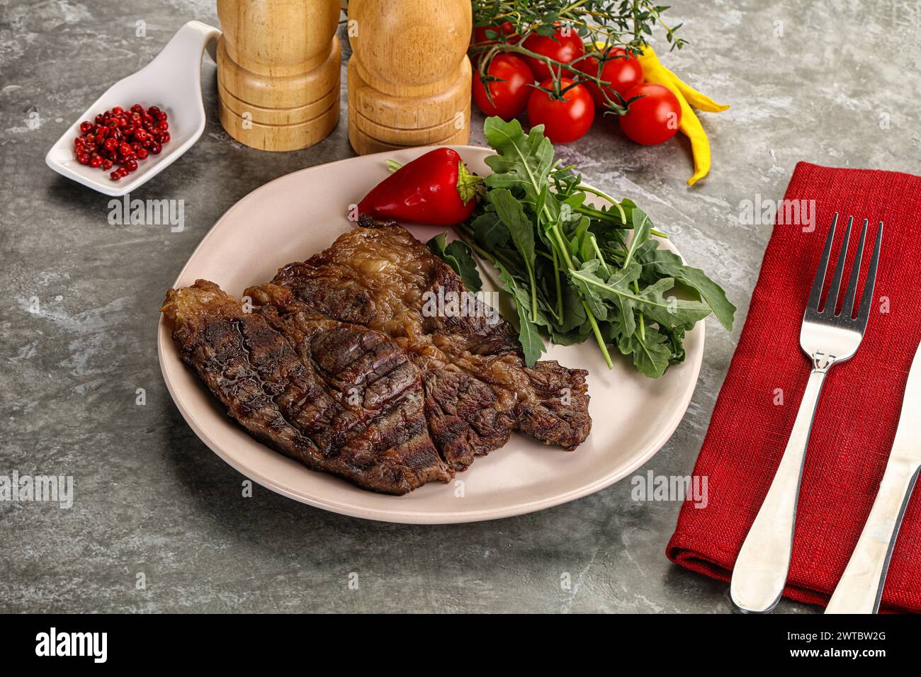 Grilled chuck roll beef steak with arugula Stock Photo - Alamy