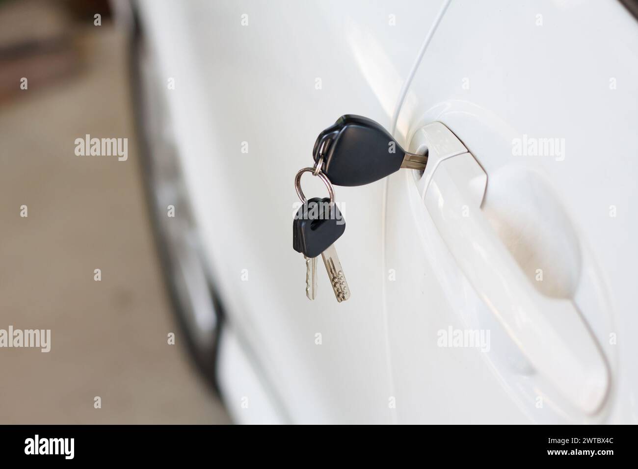 Car keys left in the car door Stock Photo - Alamy