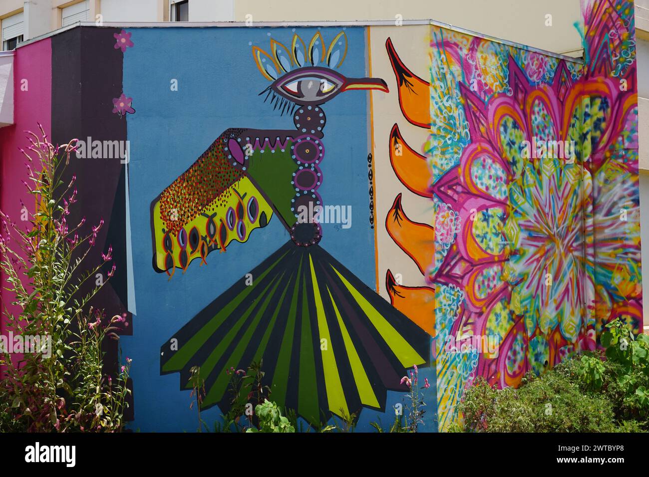 closeup of colorful, fun and different painted wall mural on a building ...